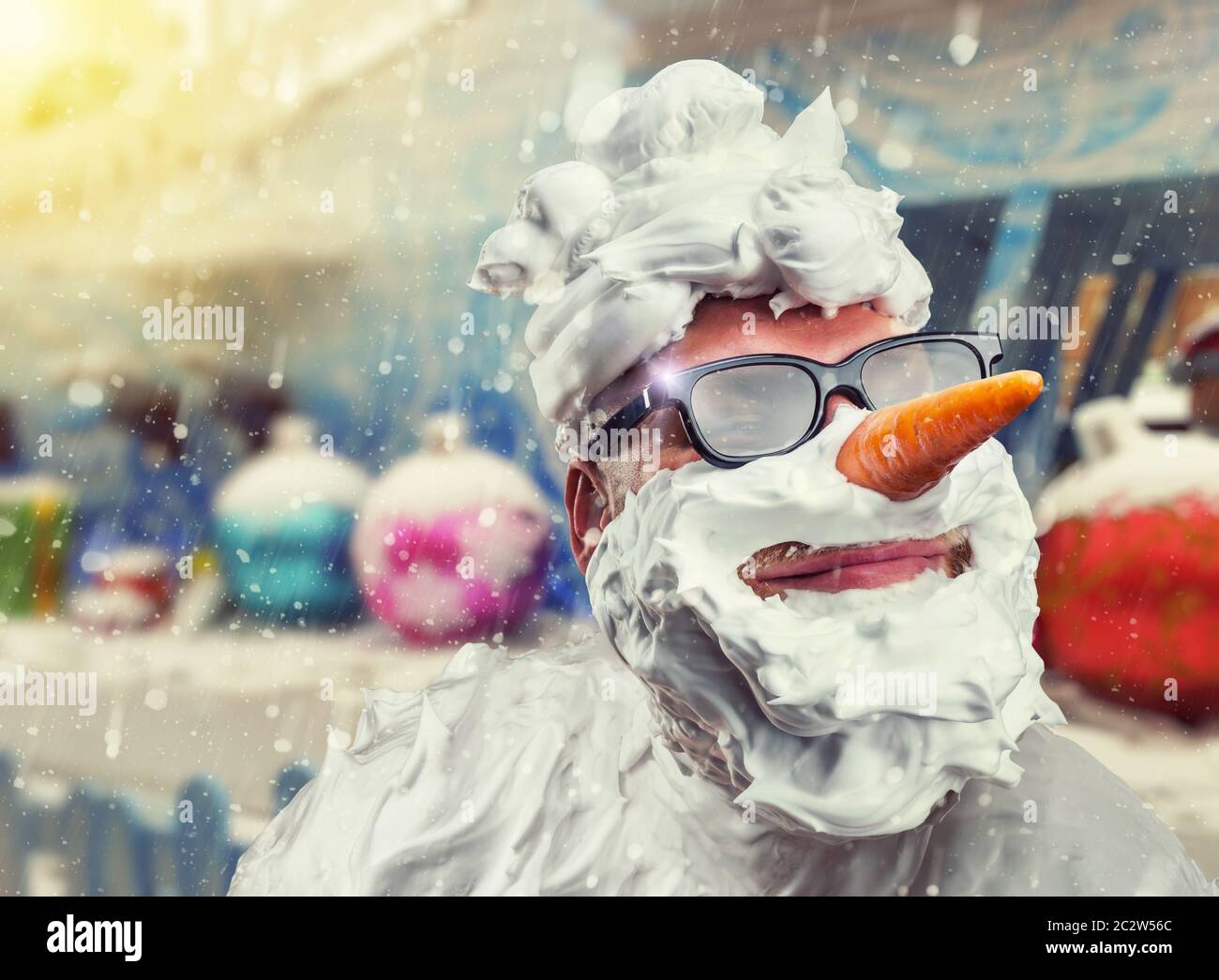 Strange smiling man with carrot nose and with shaving foam on his face ...