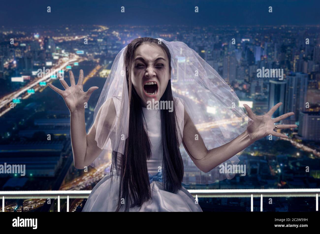 Screaming zombie bride, night city on background. Disheveled woman with ...