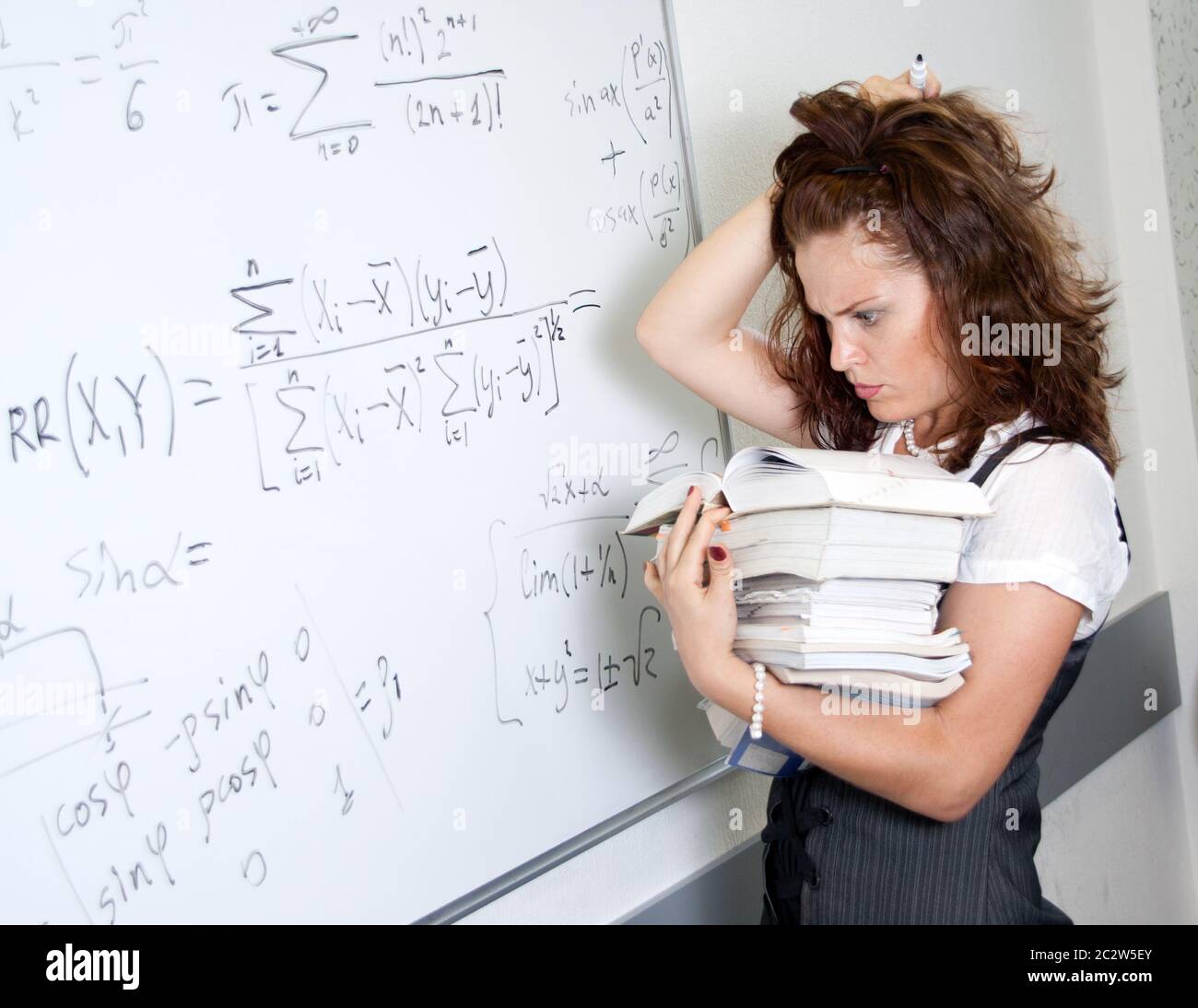 Thinking student at blackboard. Crazy mathematics Stock Photo - Alamy