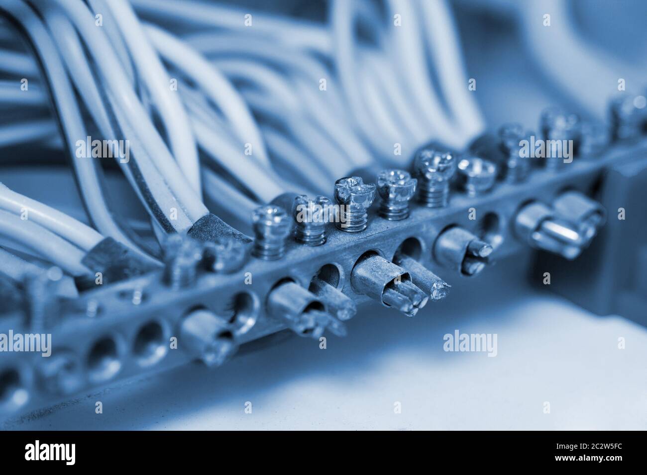 Power lines in electrical strip. Toned in blue Stock Photo - Alamy