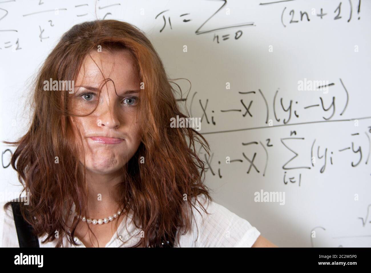 Woman writing math formulas hi-res stock photography and images - Alamy