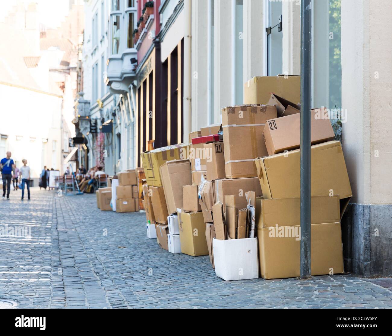 Carton garbage boxes on sidewalk, european city. Full trashbox on the ...