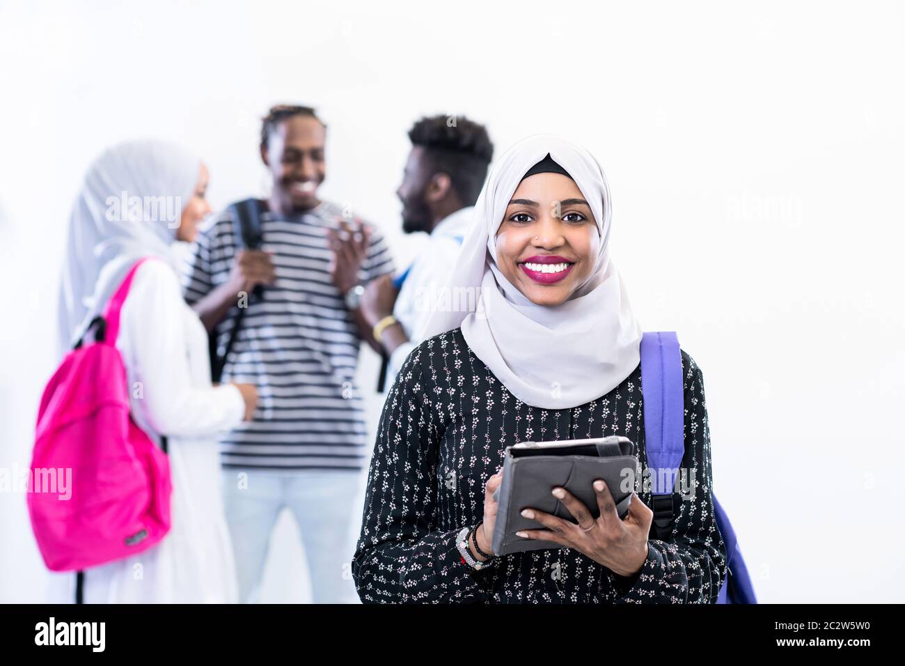 muslim female student with group of friends Stock Photo - Alamy