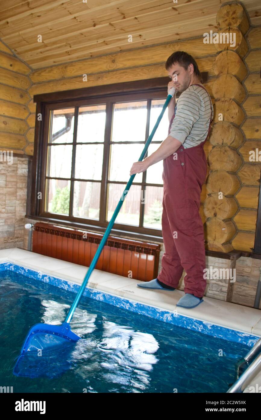 Pool guy at work Stock Photo - Alamy
