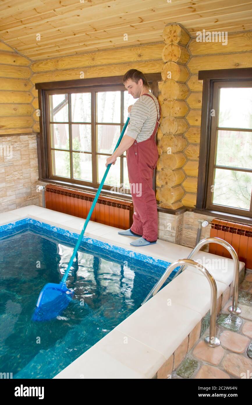 Pool guy at work Stock Photo - Alamy