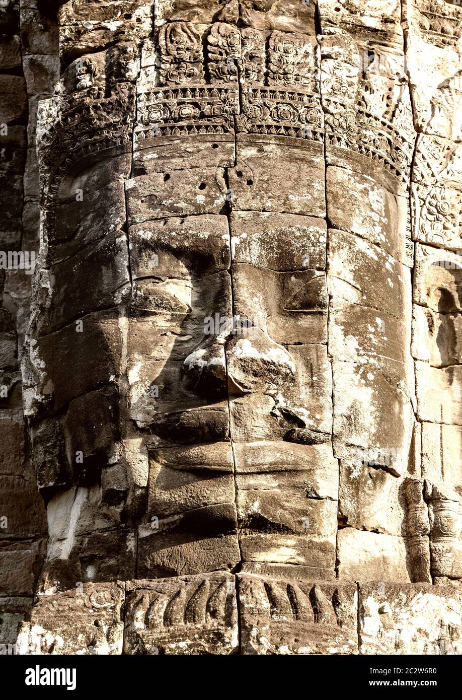 Stone face on towers of Bayon temple closeup Stock Photo - Alamy