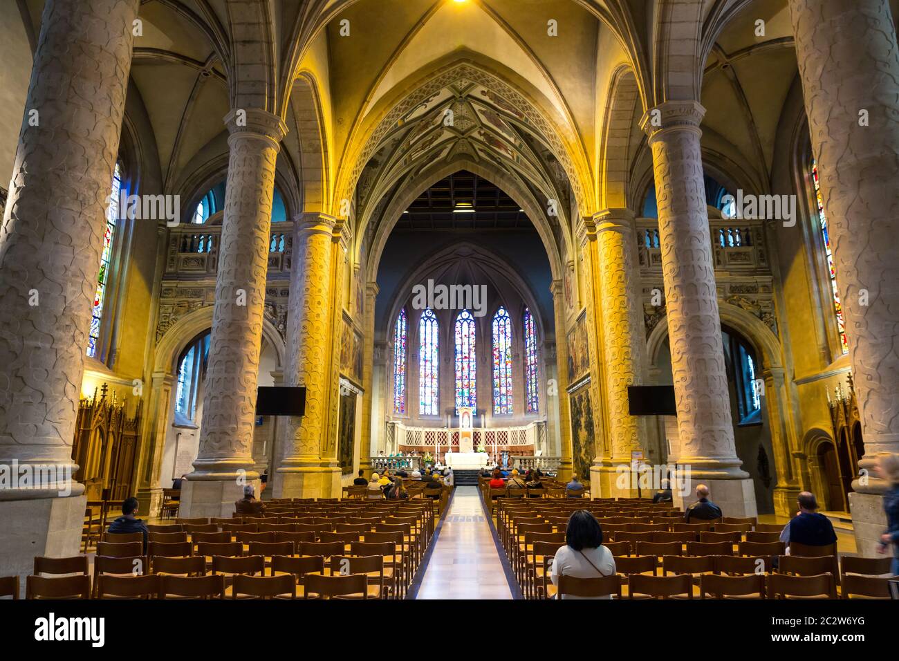 Service in hall of old temple, Europe. Ancient european architecture ...