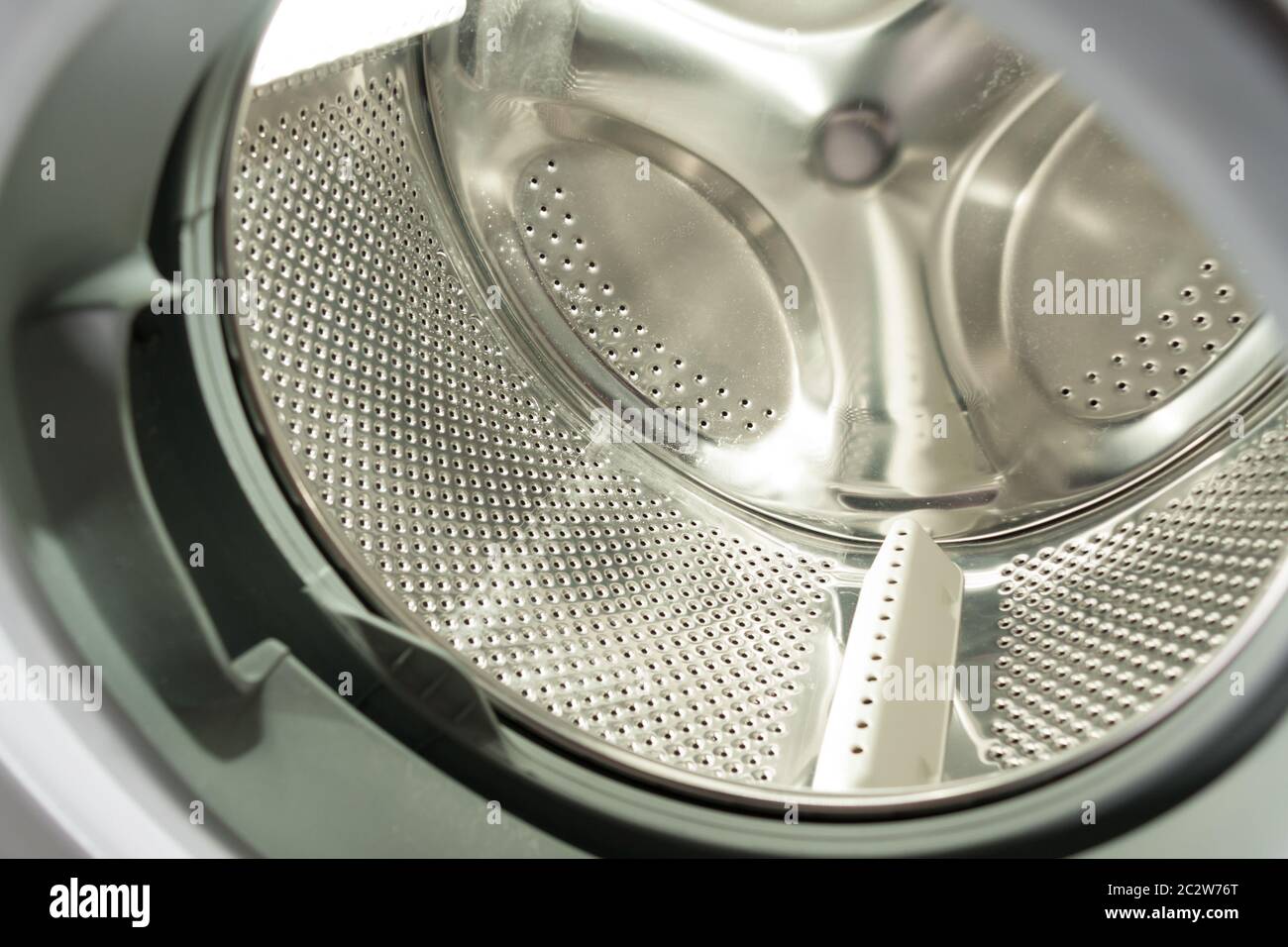 Empty washing machine drum closeup Stock Photo - Alamy