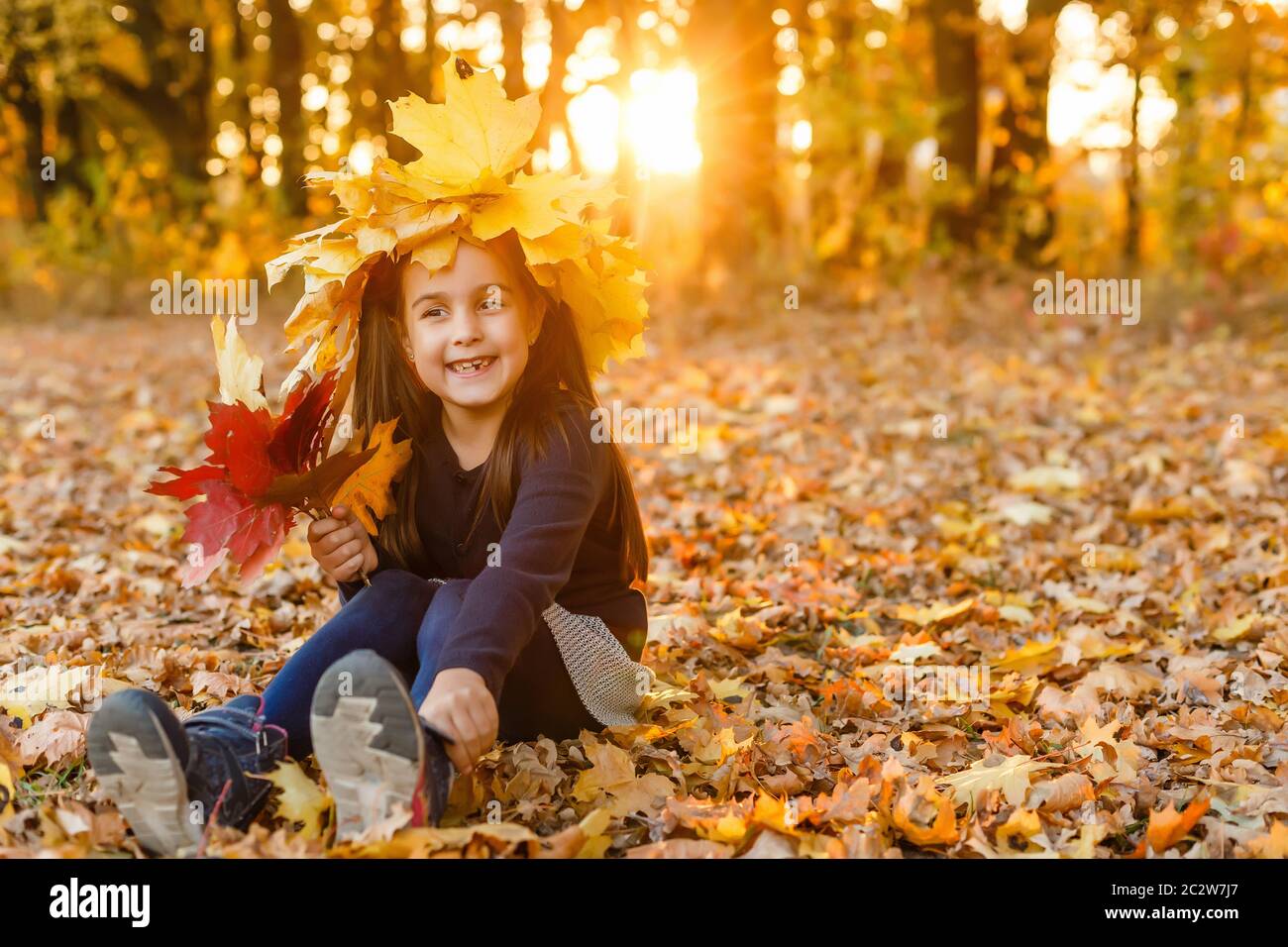 happy little child, girl laughing and playing in the autumn on the ...