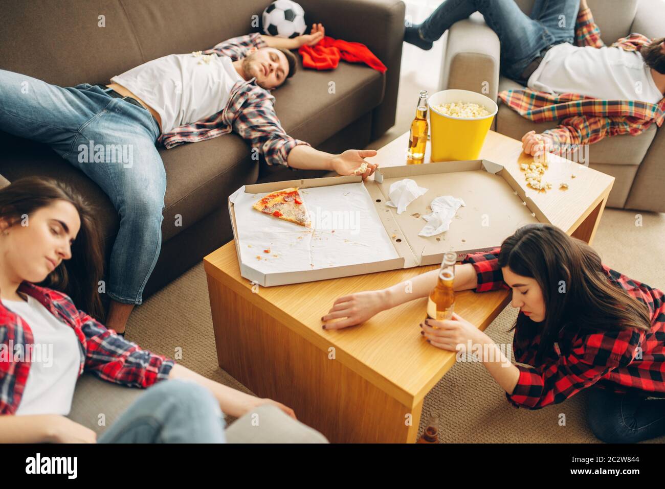 Football fans sleep after alcohol party at home, hangover morning ...