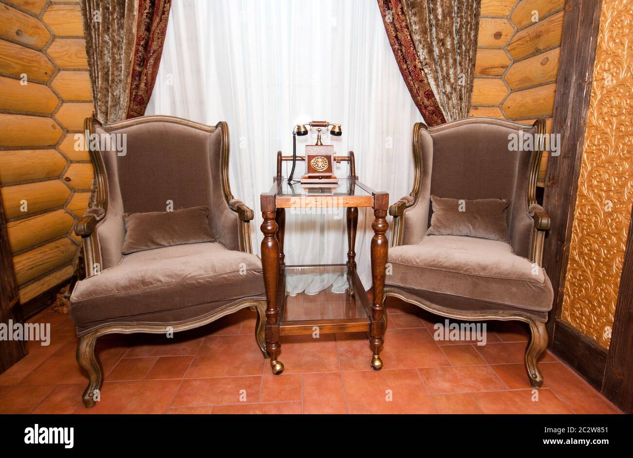 Vintage interior - telephone and armchairs Stock Photo - Alamy