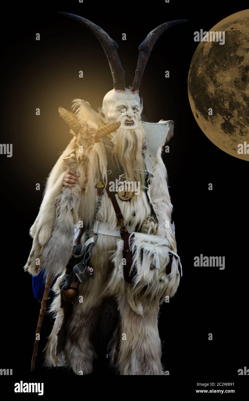 Spirit or Demon holding a stick at full moon Stock Photo - Alamy