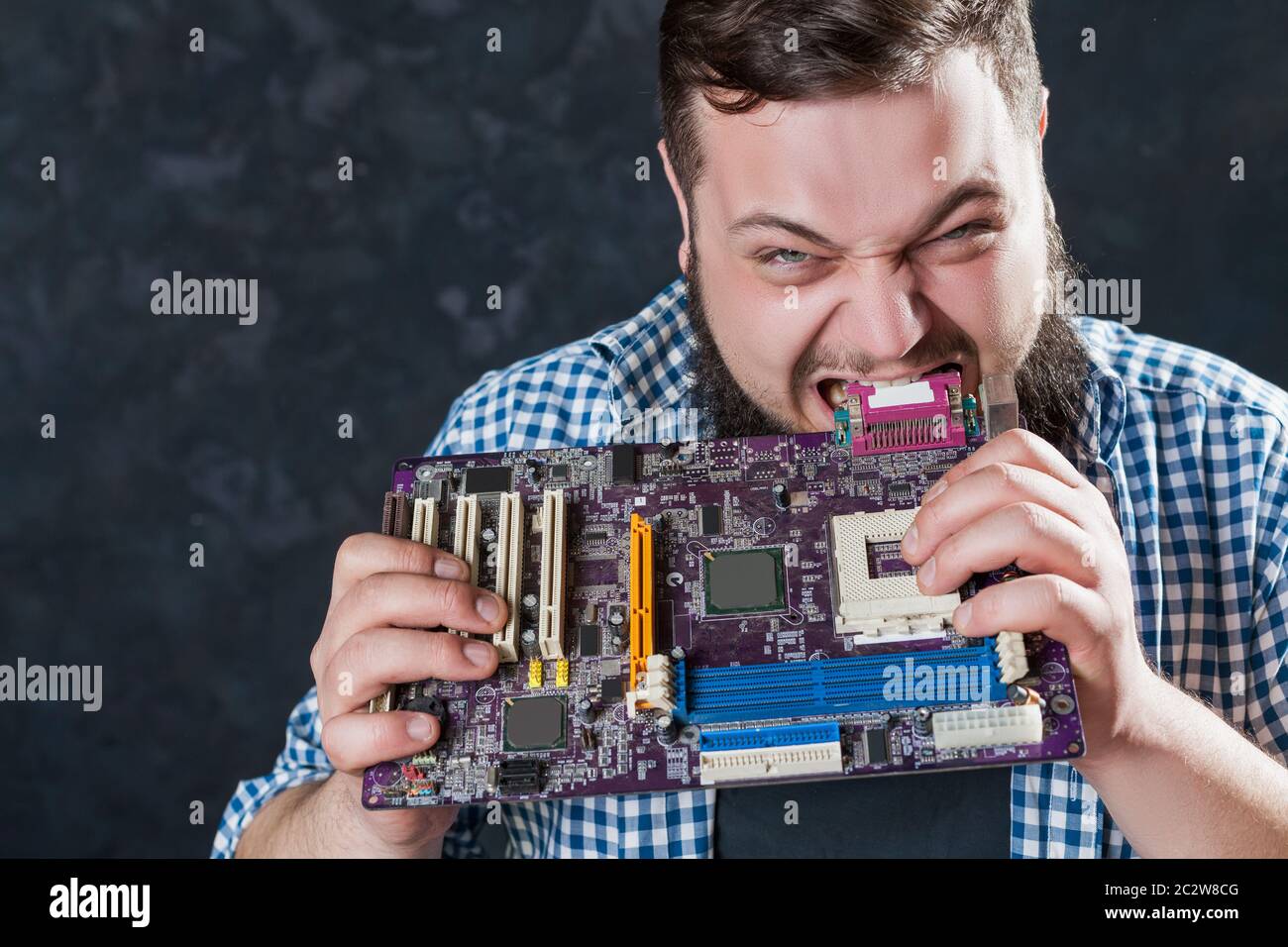 Service engineer repair computer motherboard. Repairman makes ...