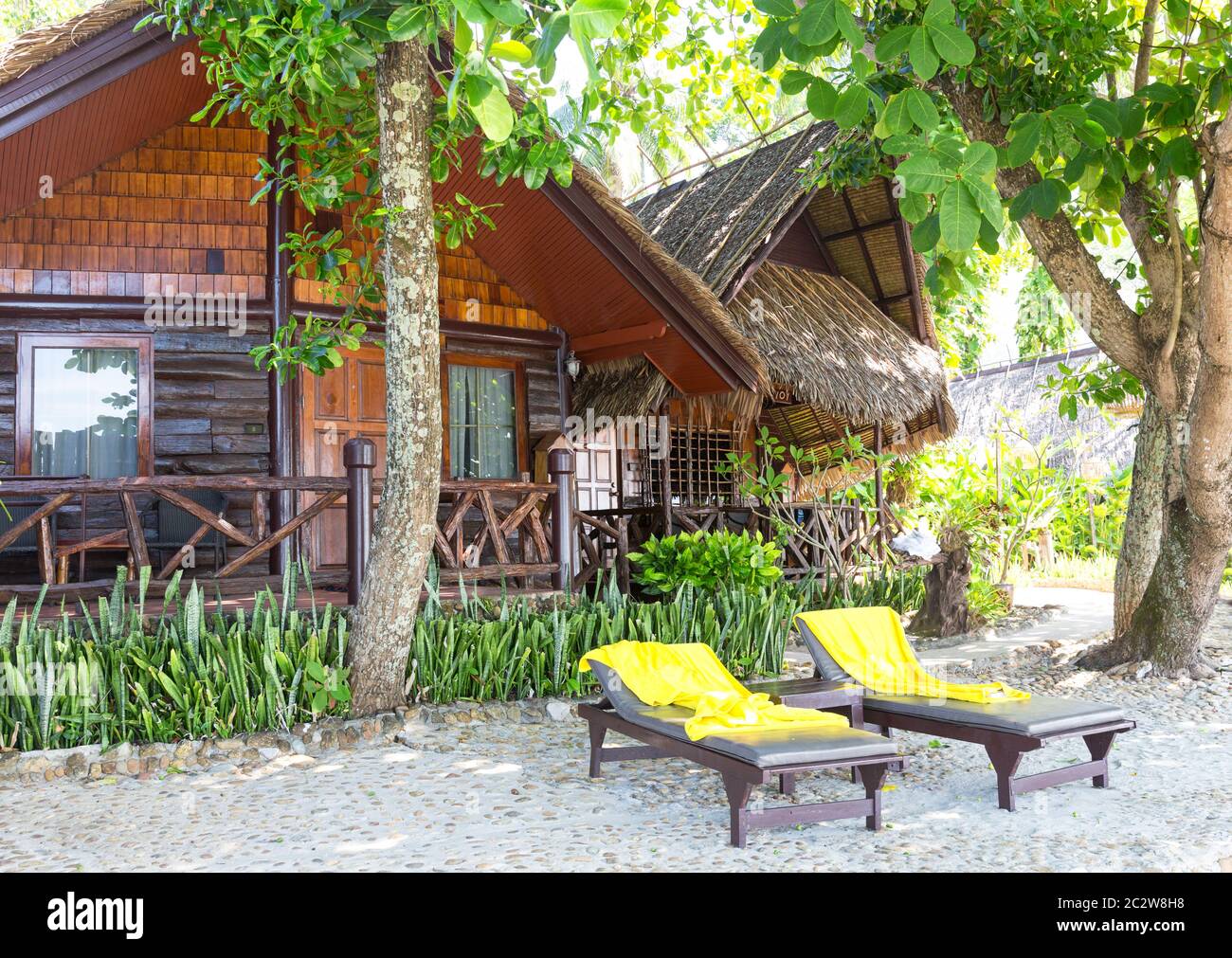 Tropical house under the trees Stock Photo - Alamy