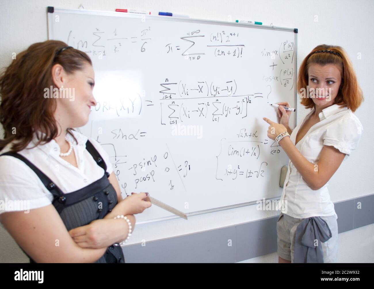 Teacher and student at blackboard Stock Photo - Alamy