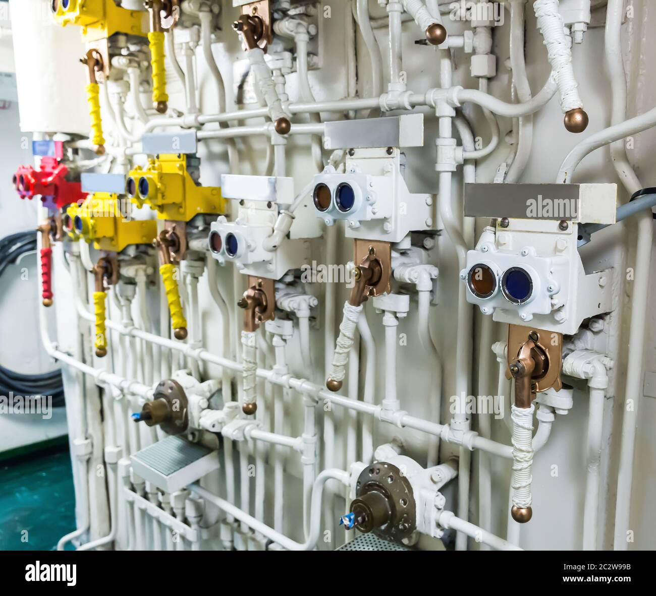 Engineering interior of military ship including pipes, cables, pumps ...
