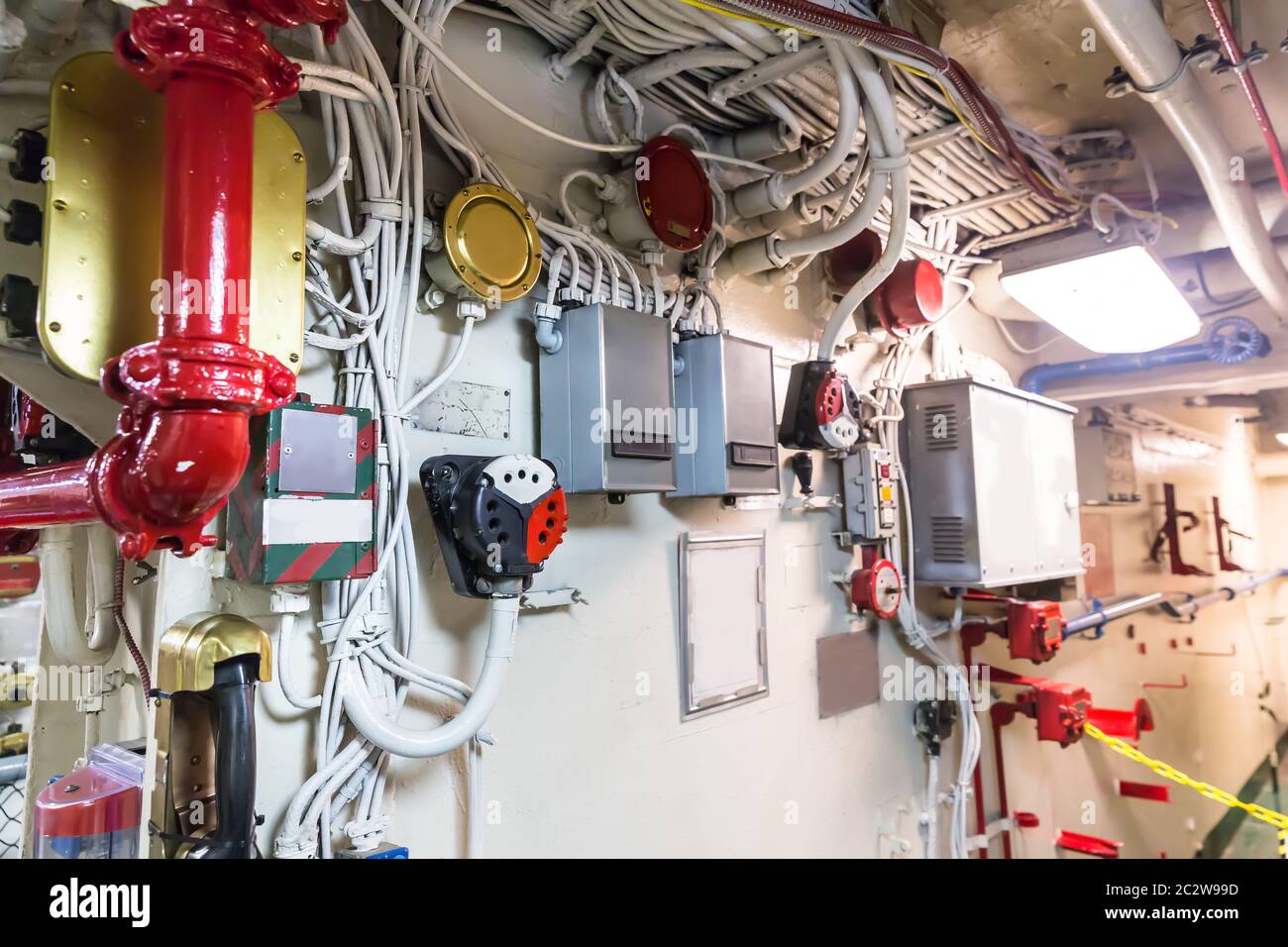 Engineering interior of aircraft carrier including pipes, cables, pumps ...