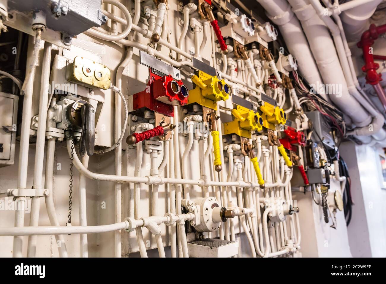 Engineering interior of aircraft carrier including pipes, cables, pumps ...