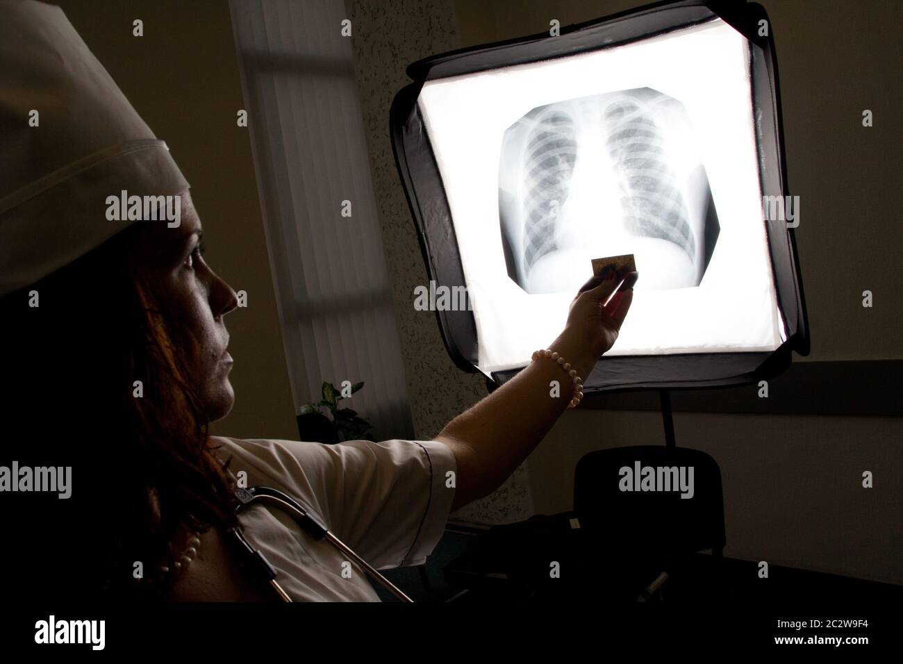 Doctor with chest X-ray isolated Stock Photo - Alamy
