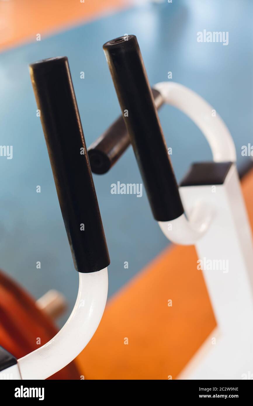 New sport machine with handles in the modern gym Stock Photo - Alamy