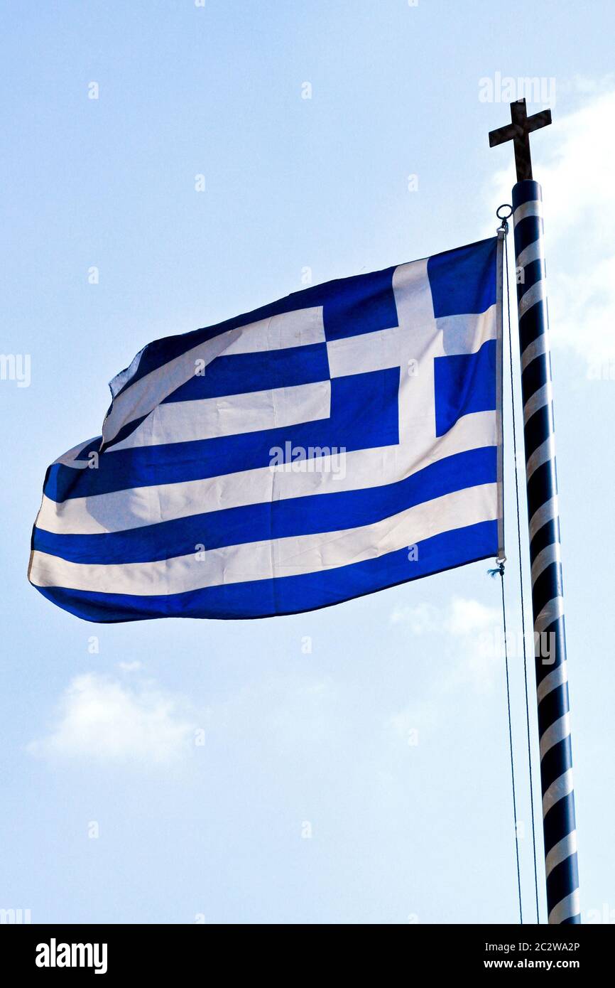 Greece flag at pole with church cross Stock Photo - Alamy