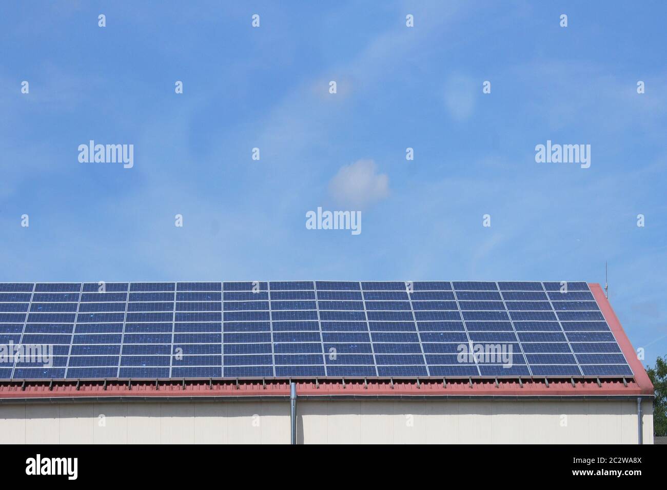 solar panels on a factory building roof Stock Photo - Alamy