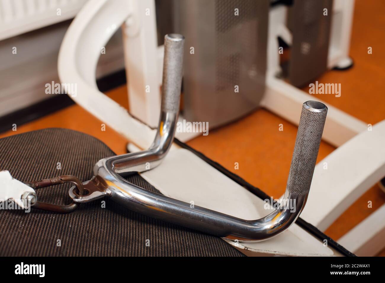 Close up of sport machine handle for chest and hand muscles in the gym ...