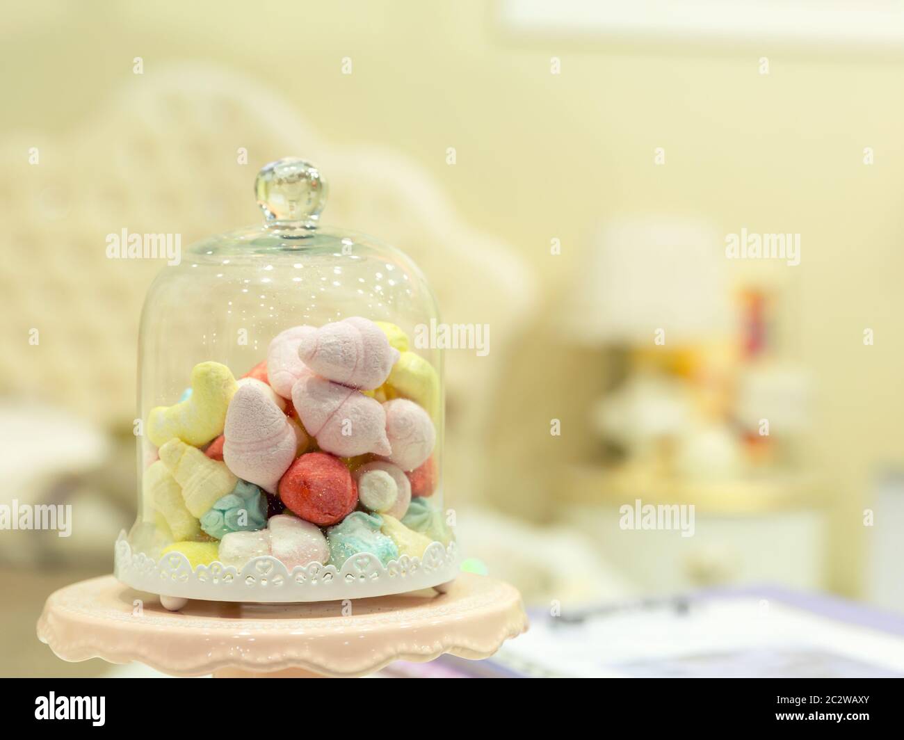 Small candies in nice room interior closeup Stock Photo - Alamy