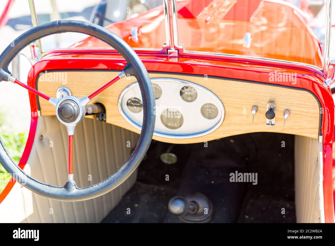 Rudder of a red vintage car close up Stock Photo - Alamy