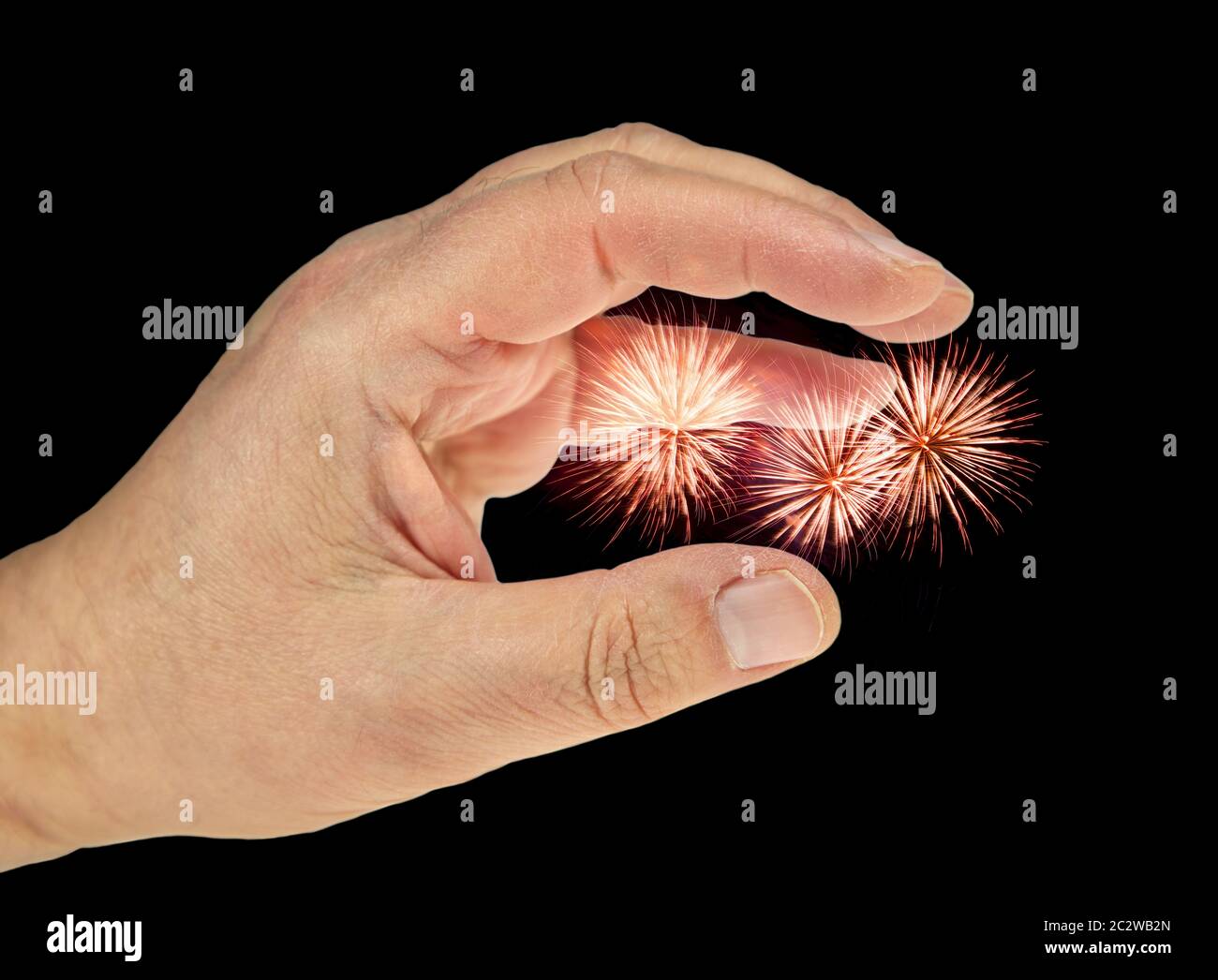 Hand with fireworks Stock Photo - Alamy