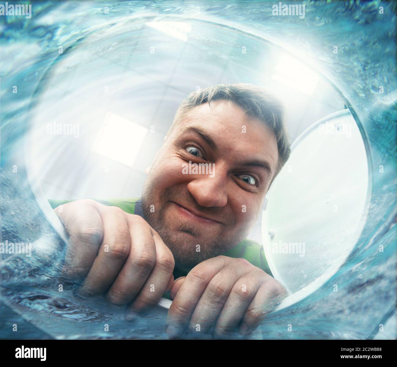 Man with head in toilet bowl hi-res stock photography and images - Alamy