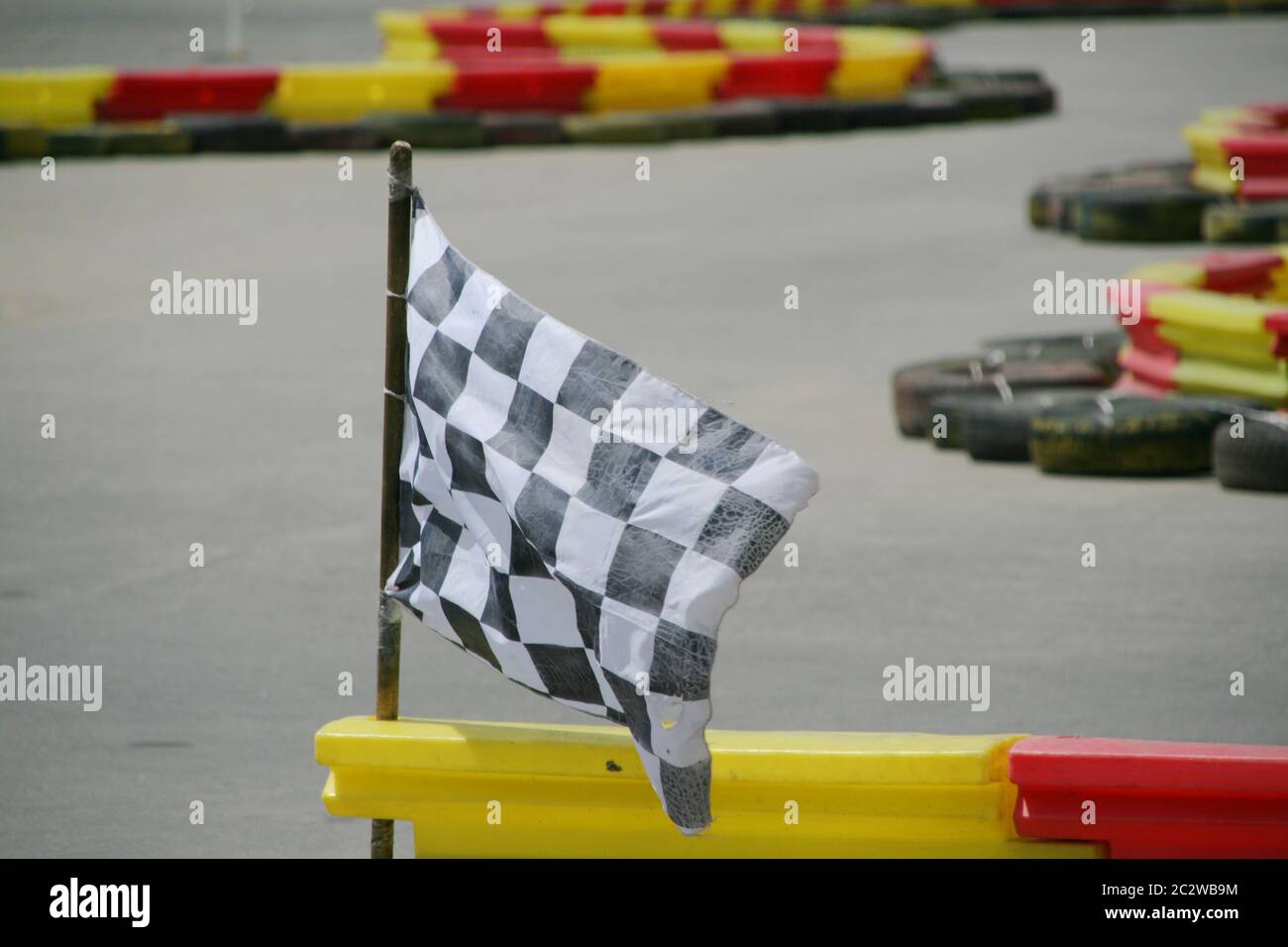 Checkered flag in rally track Stock Photo - Alamy