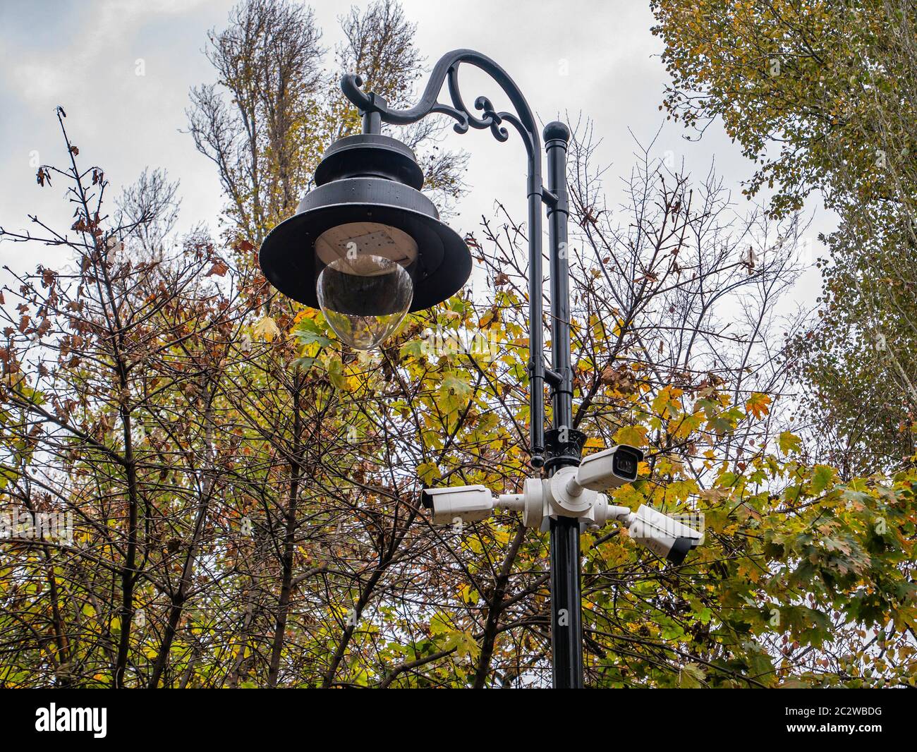 Outdoor surveillance cameras on a street lighting pole. Security. Place ...