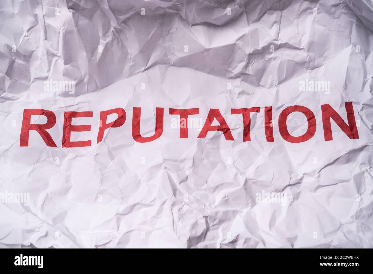 Close-up Of A Reputation Word Over White Paper With Creased Stock Photo ...