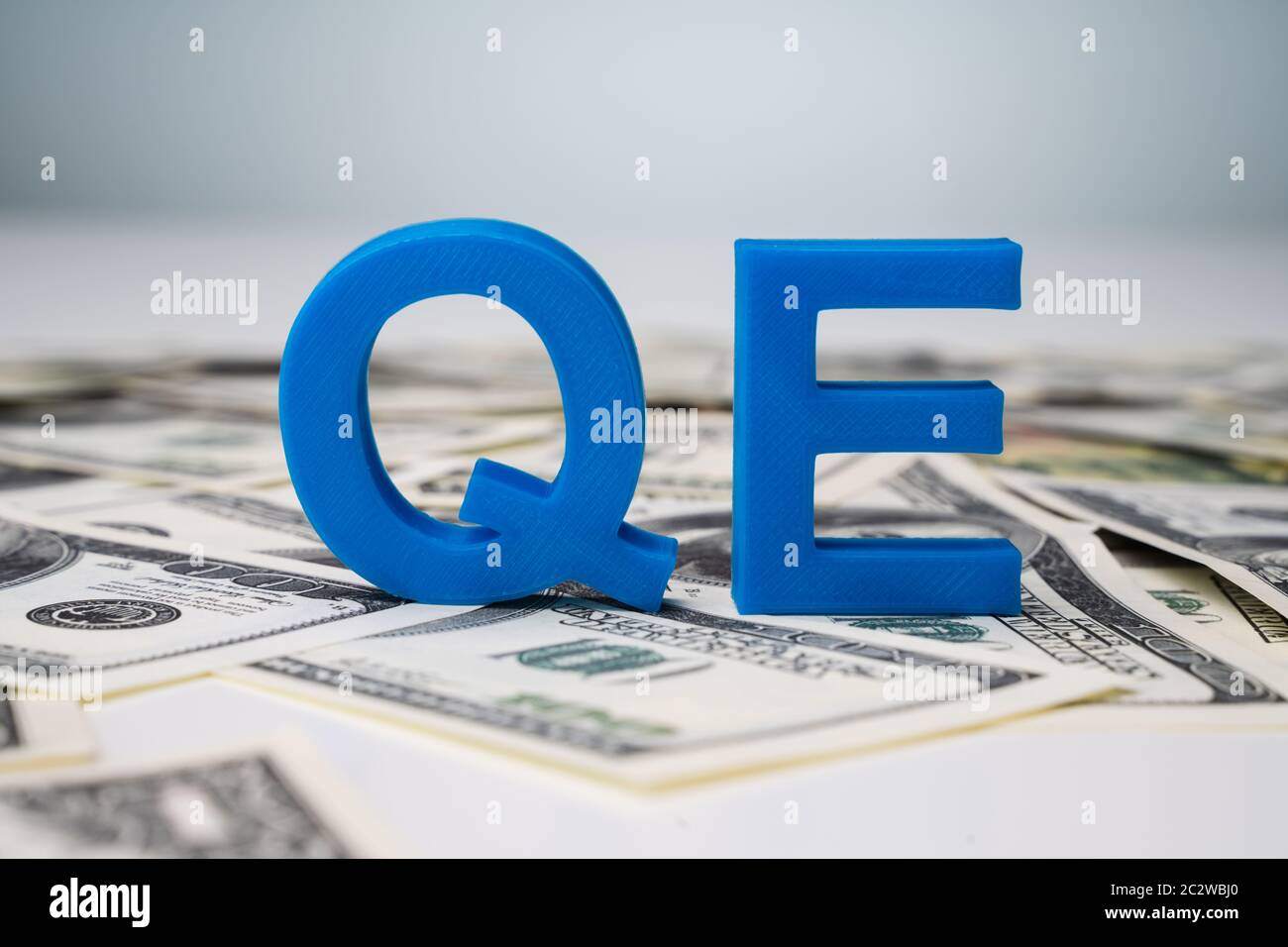 Quantitative Easing Letters On US Dollar Bills Stock Photo - Alamy