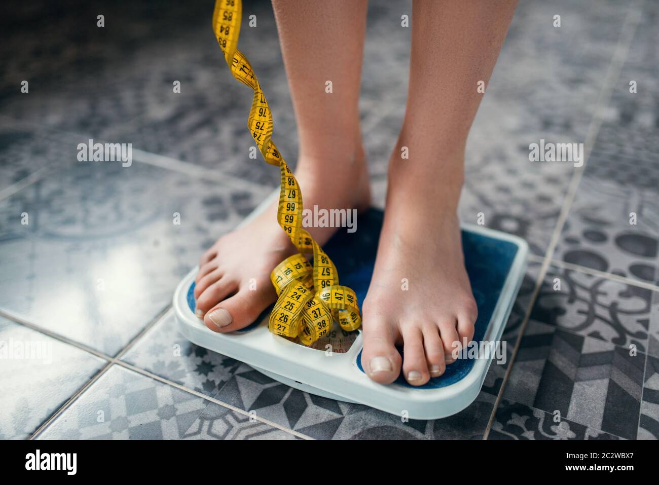 Fat belly on scales hi-res stock photography and images - Alamy