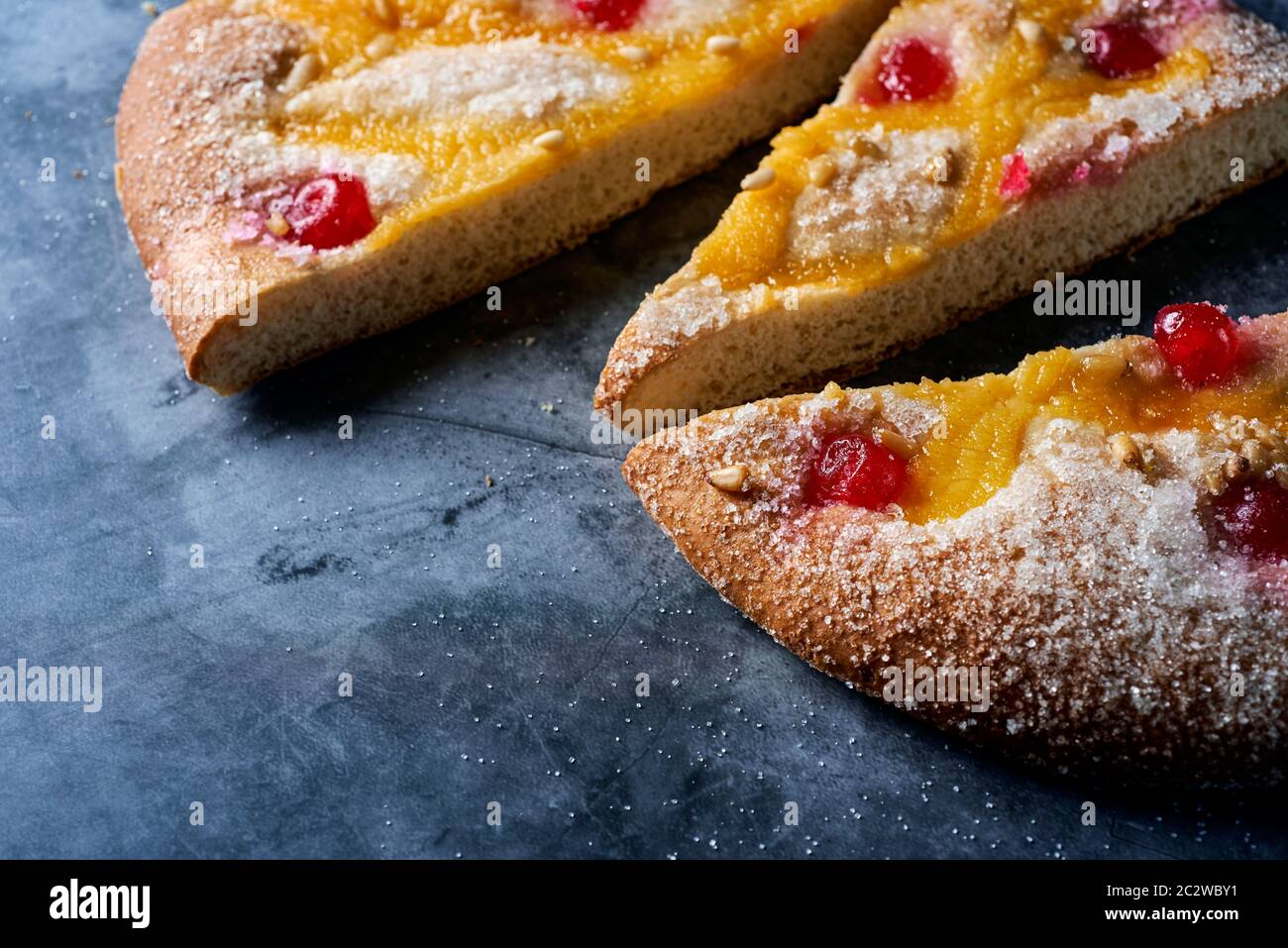 closeup of some pieces of a coca de Sant Joan, a typical sweet flat ...