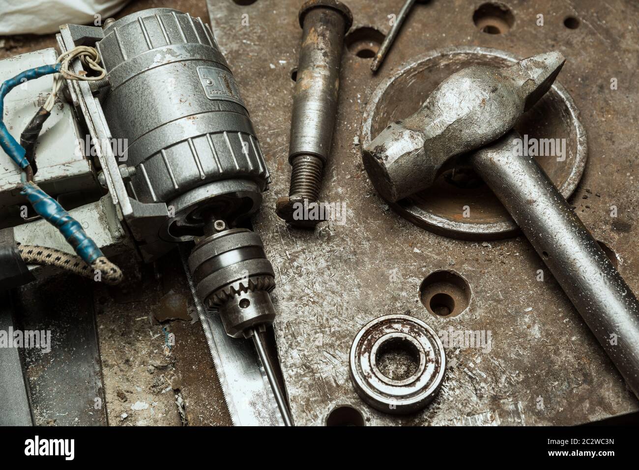 Old drill machine, hammer, machanic tools in the workshop Stock Photo ...