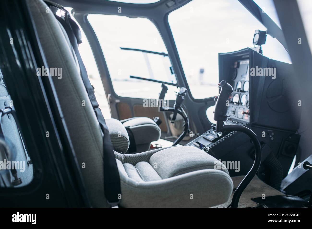 Inside helicopter cabin, control panel, side view from opened door ...
