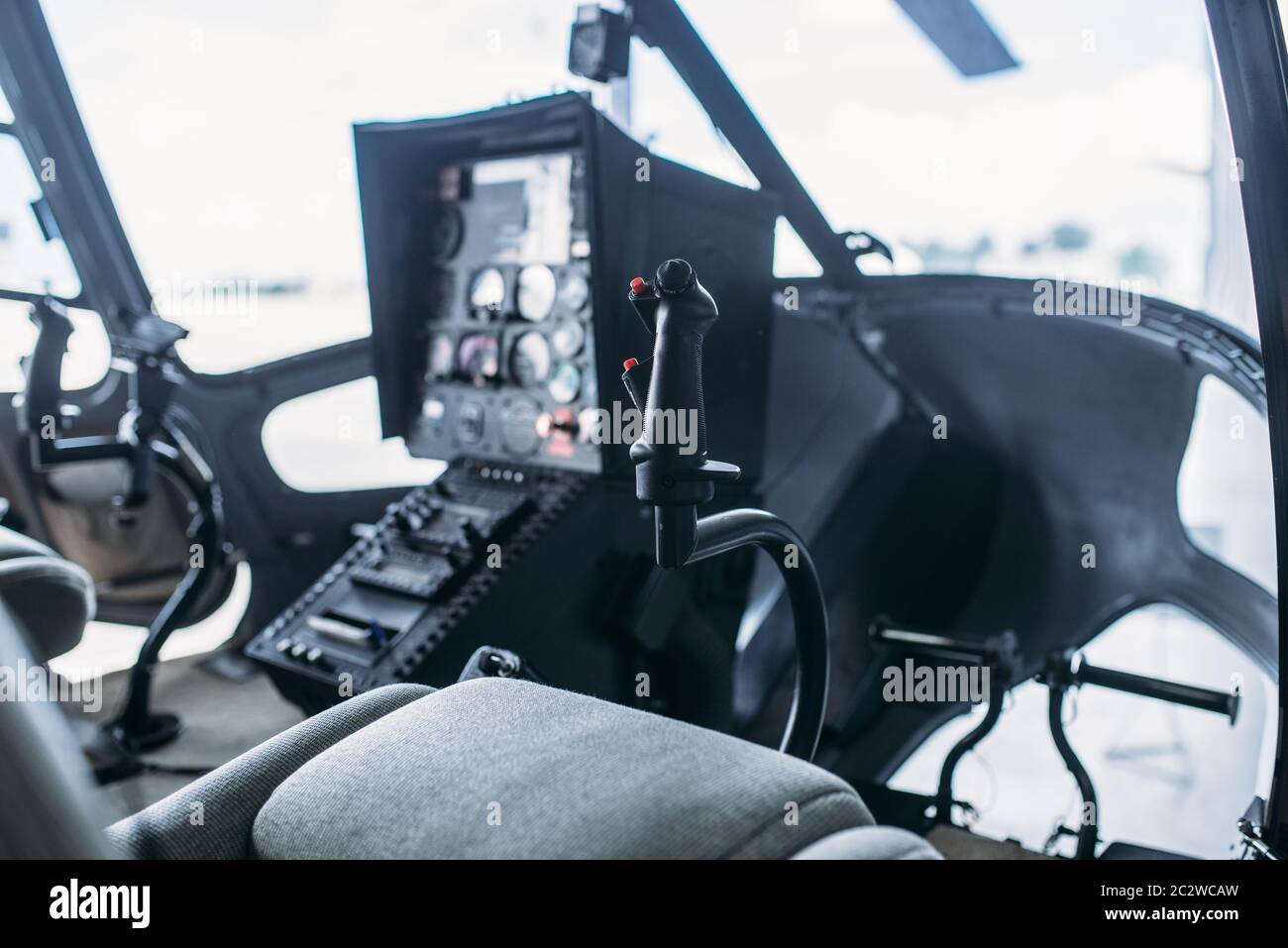 Inside helicopter cabin, control panel, side view from opened door ...