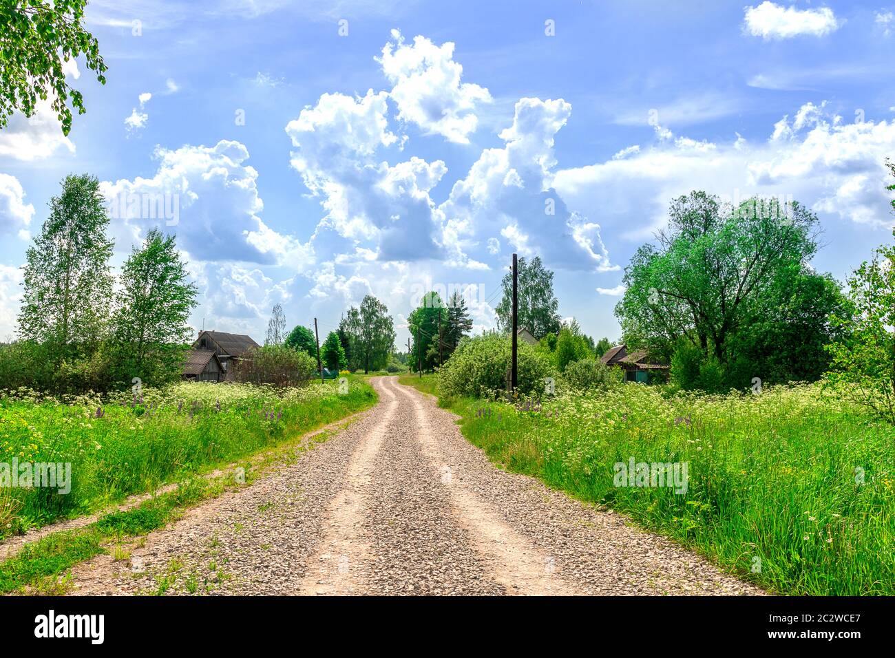 rural landscape. dirt road in rural areas, wooden houses and sky Stock ...