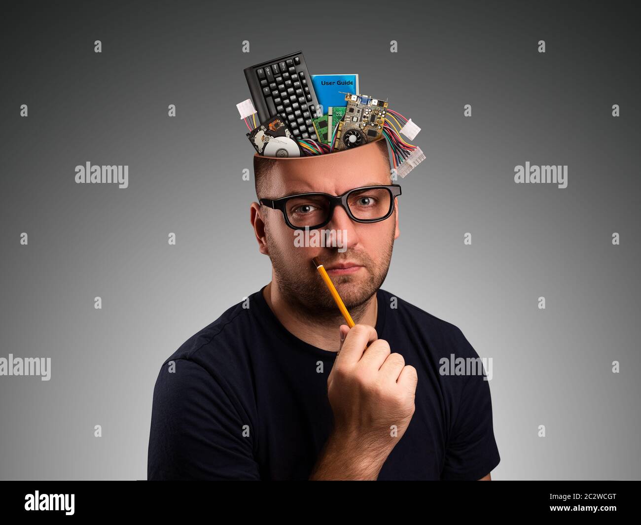 Man with computer details in the head holding a pencil Stock Photo - Alamy