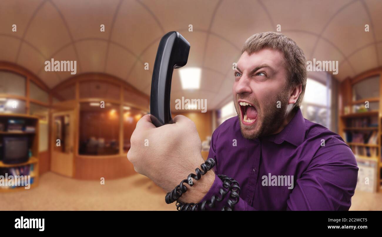 Angry businessman man screaming into the phone Stock Photo - Alamy