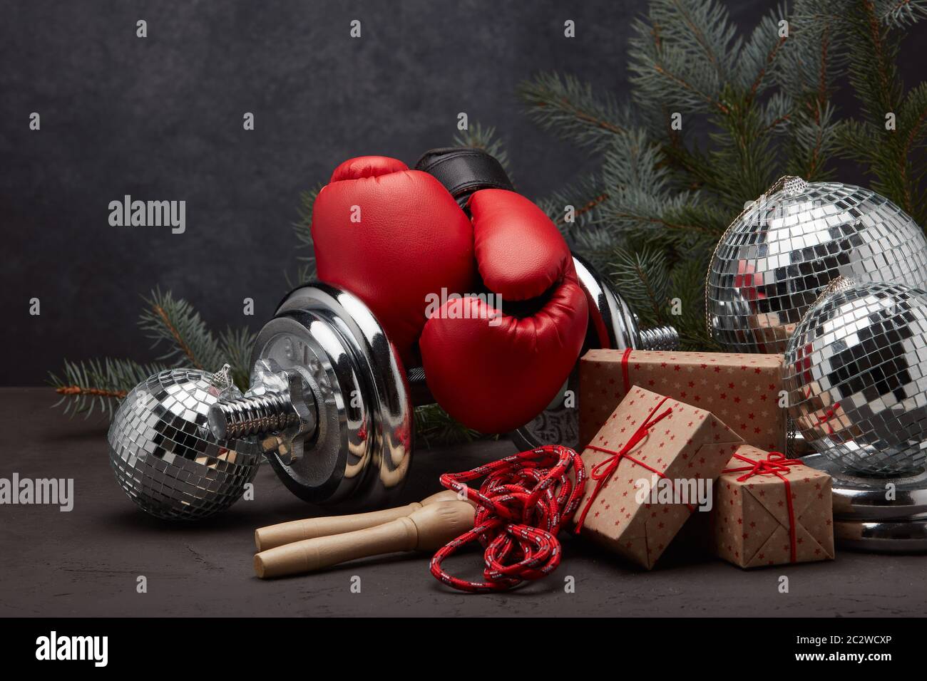 Sports equipment: dumbbell, boxing gloves, skipping rope, fir branch ...