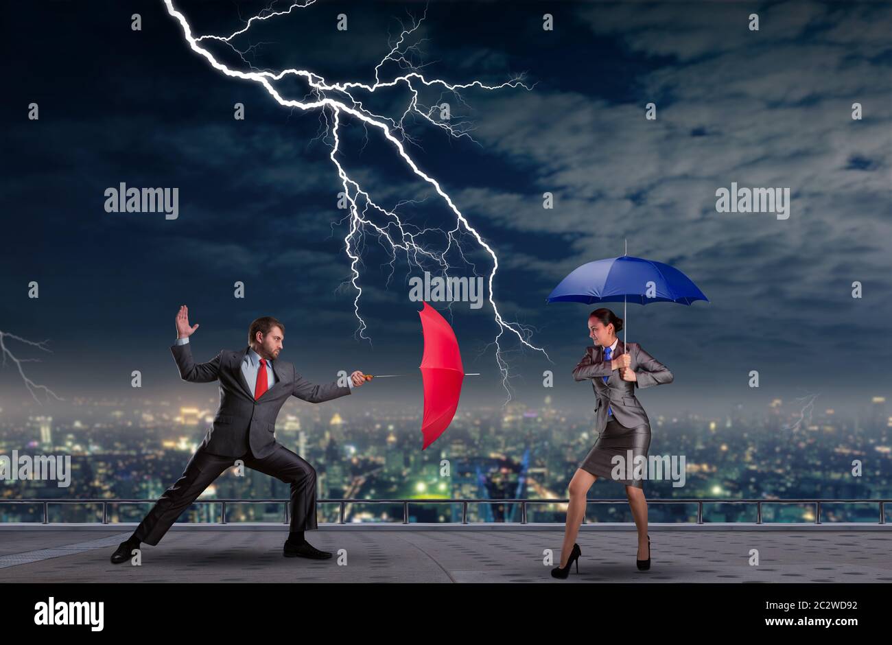 Business people fighting with umbrellas in a thunderstorm Stock Photo ...