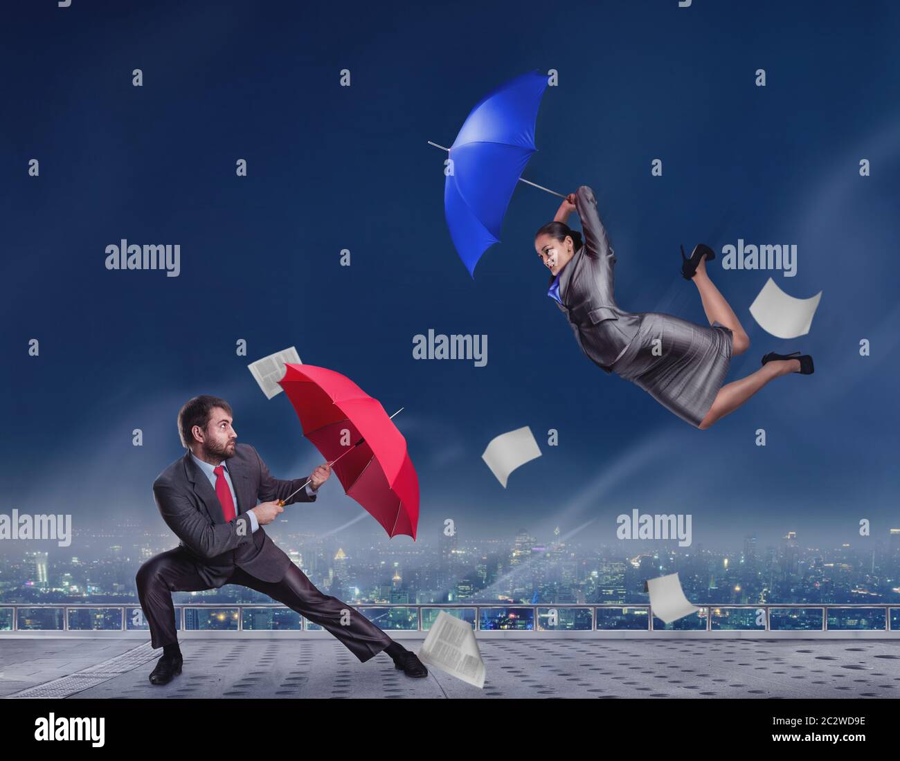 Business people fighting with umbrellas in the night Stock Photo - Alamy