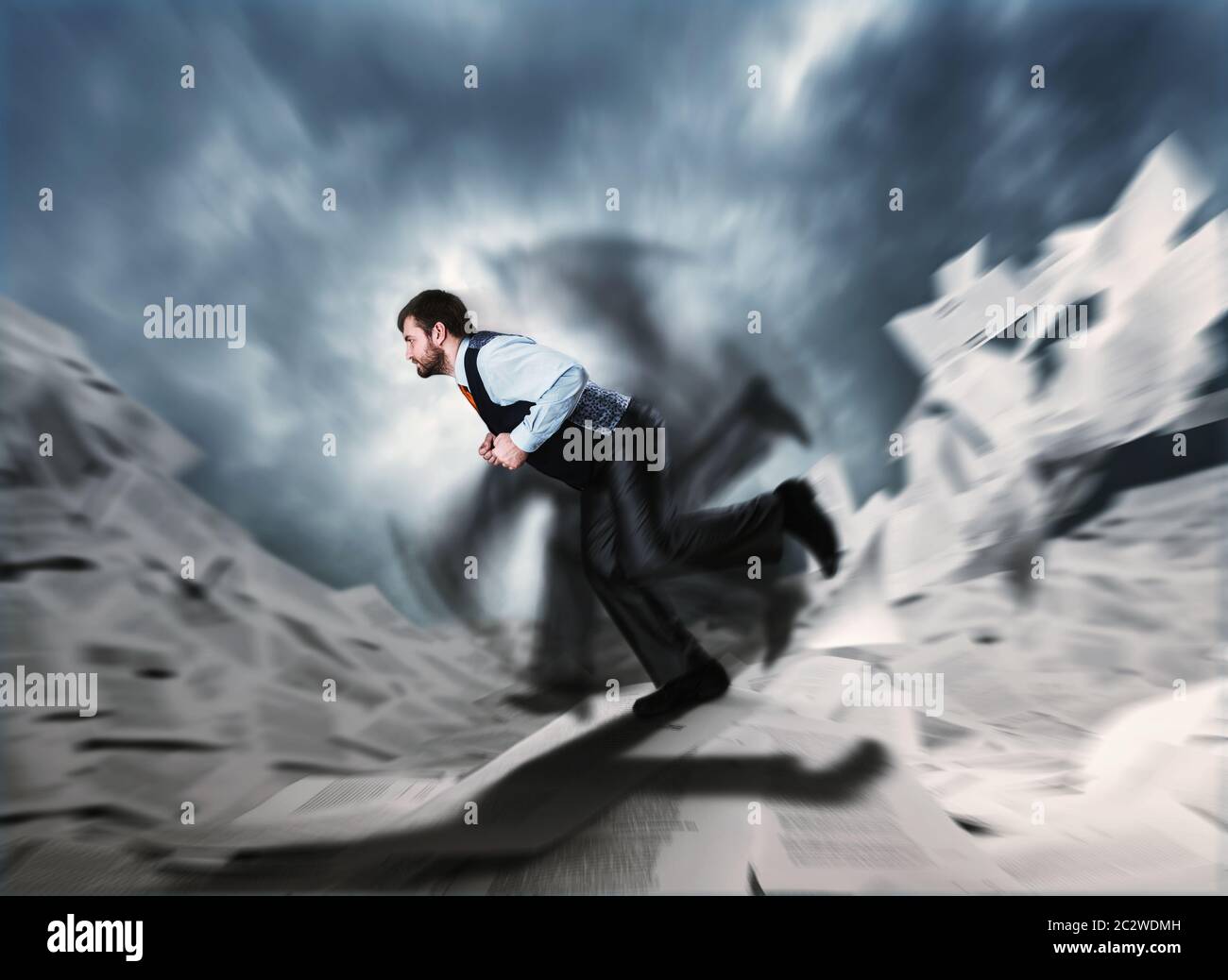 Man running in frustration against papers Stock Photo - Alamy