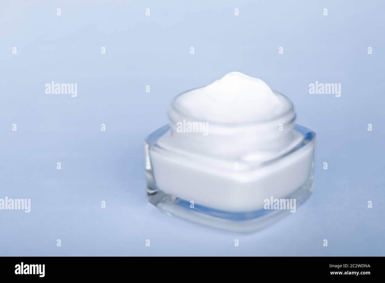 Face cream moisturizer jar on blue background, moisturizing skin care ...