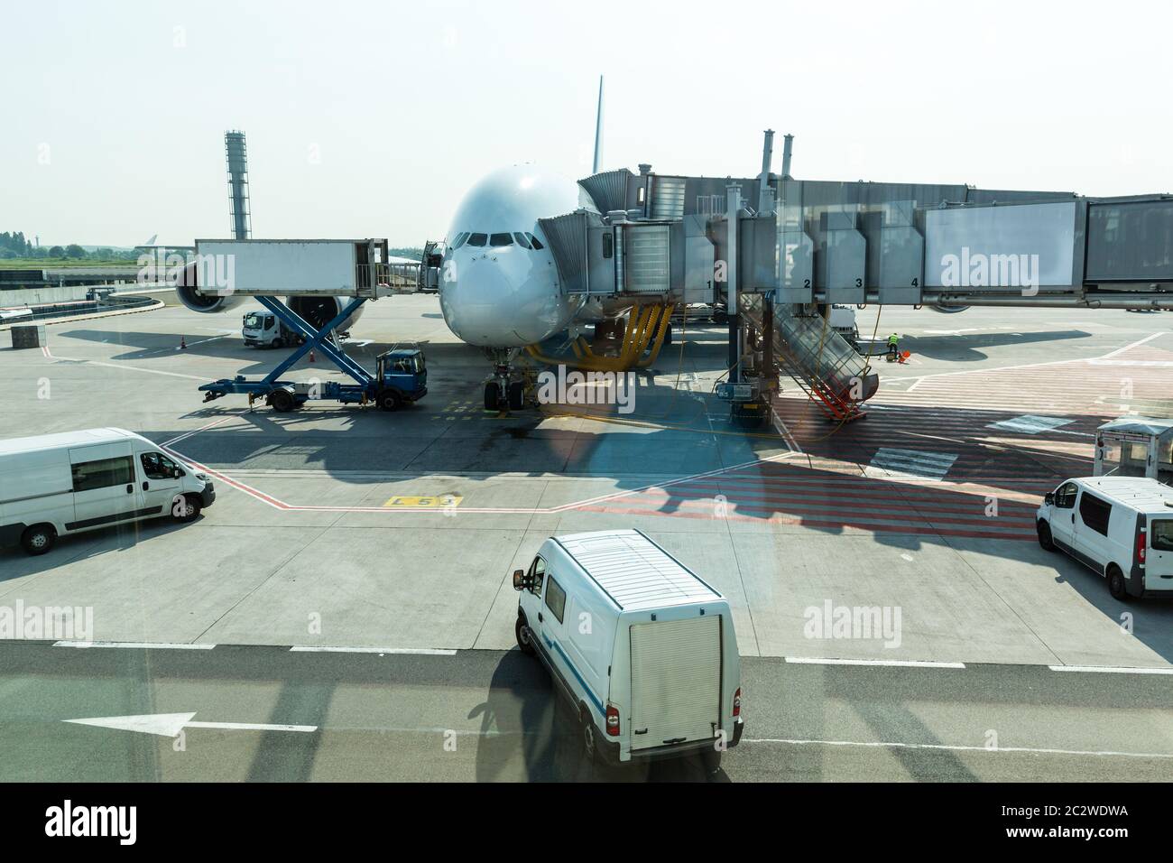 Airplane near the airport terminal, luggage loading Stock Photo - Alamy