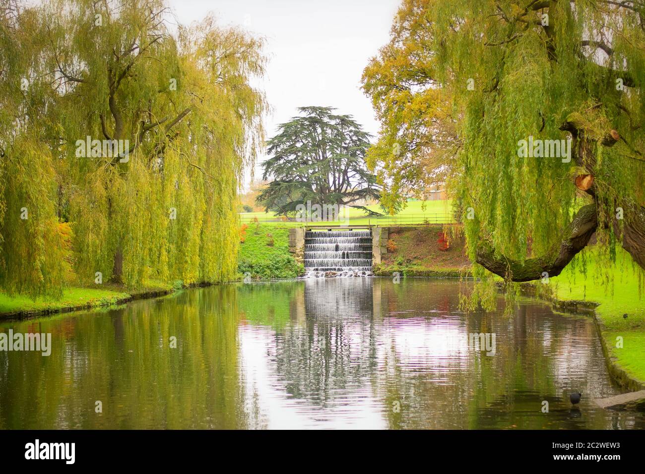 Small lake with a waterfall on the ground of Leeds castle, England ...